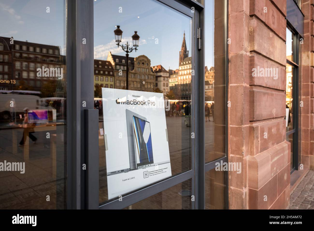 Advertising on the glass showcase of Apple store for the new redesigned ...
