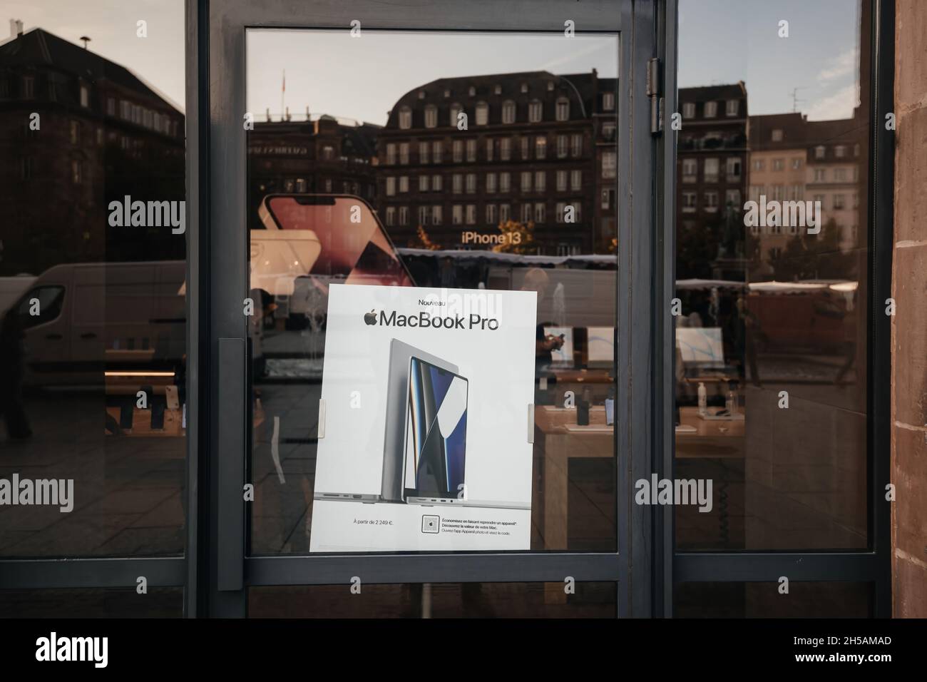 Advertising on the glass showcase of Apple store for the new redesigned ...