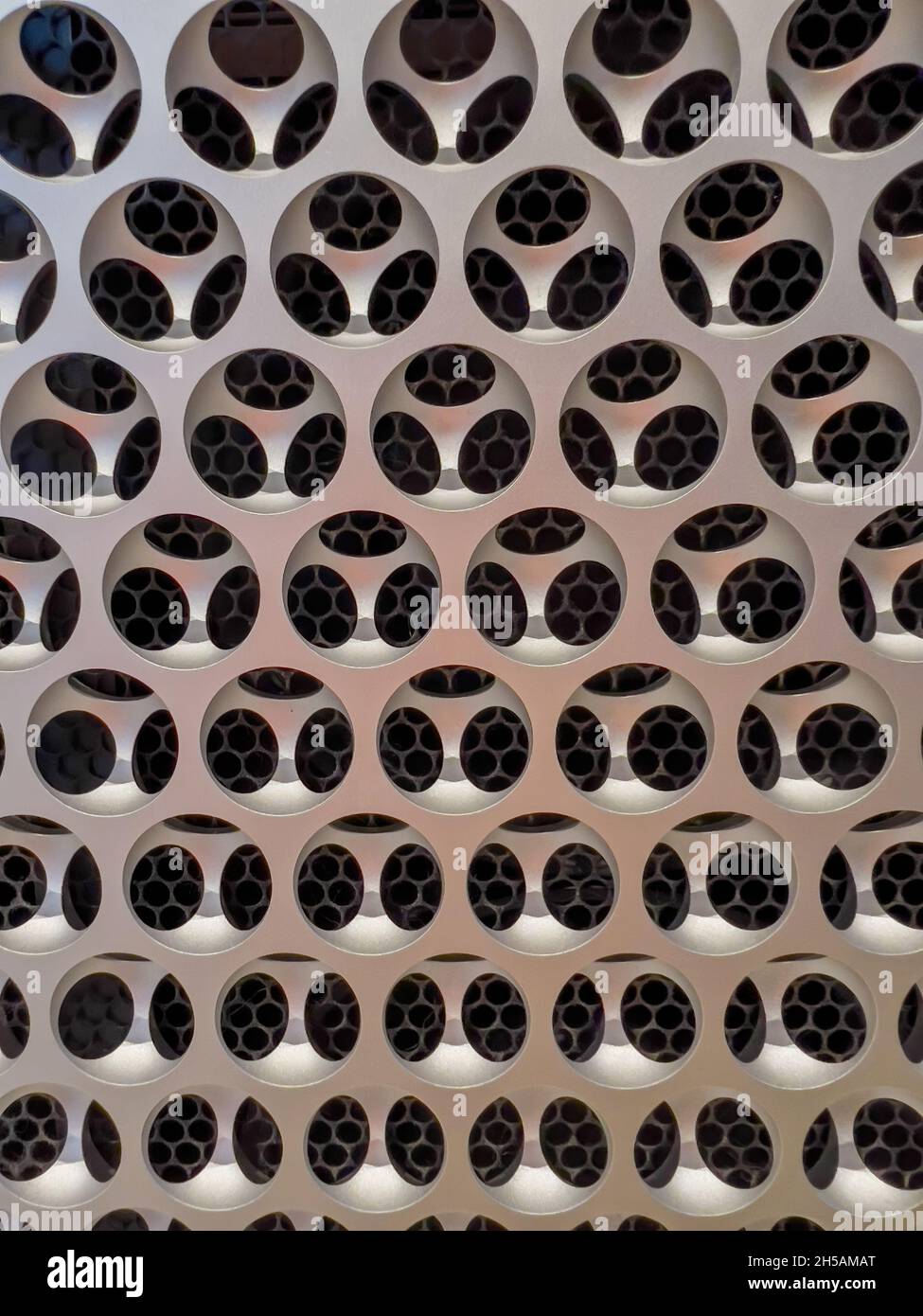 Close-up of air ducts ventilation holes on front aluminum body of Apple ...