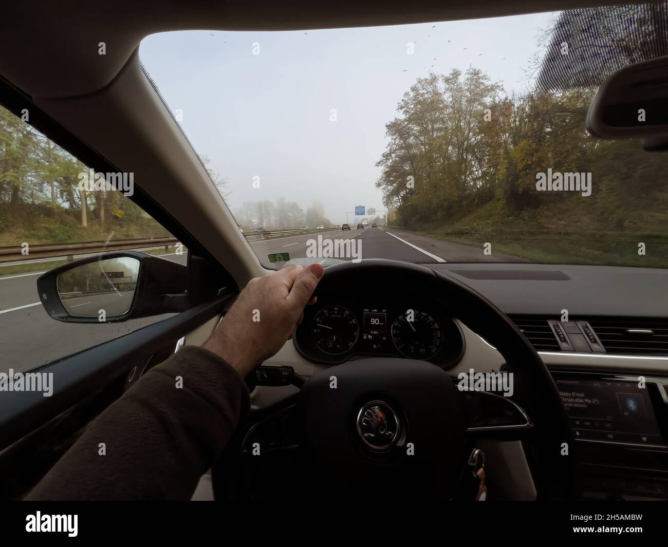 Driver POV at the fluid highway driving with cars and trucks seen from ...