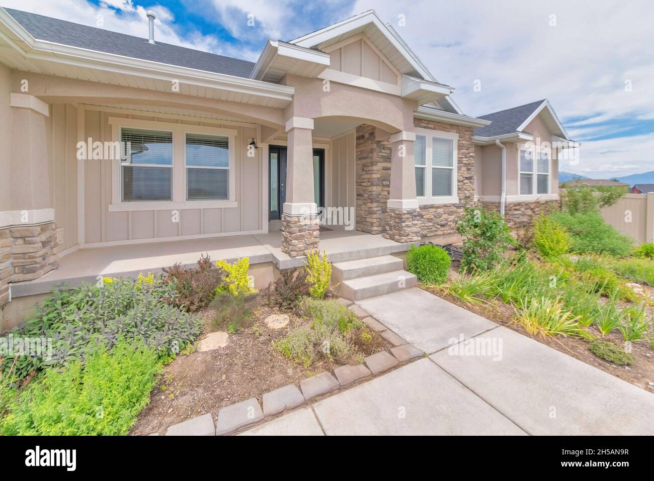 Front exterior of a house with messy front yard garden Stock Photo - Alamy