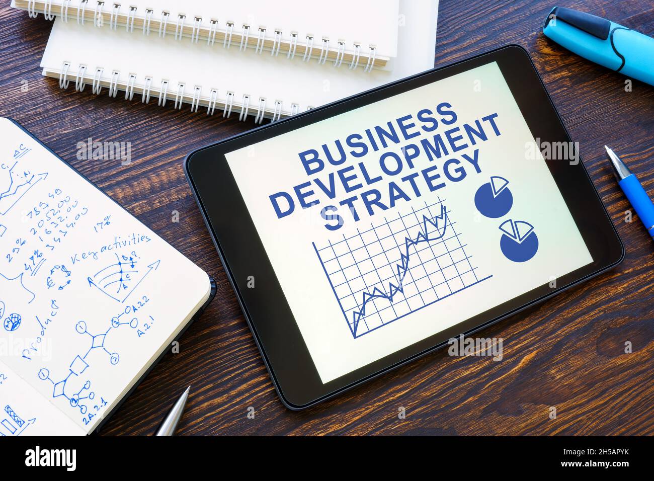 Business development strategy with charts in the tablet Stock Photo - Alamy