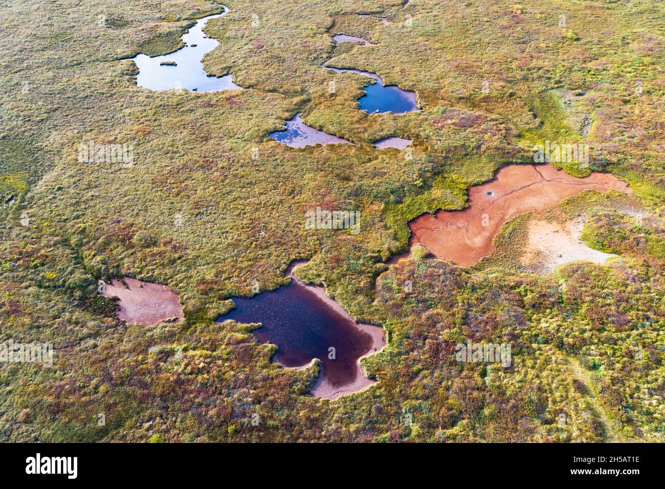Aerial view of small lakes in different colours in Hraundalur ...