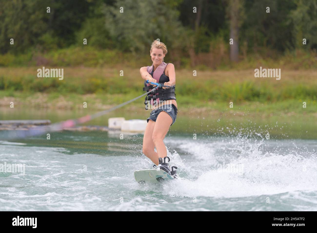 Beautiful woman enjoying jet water hi-res stock photography and images ...