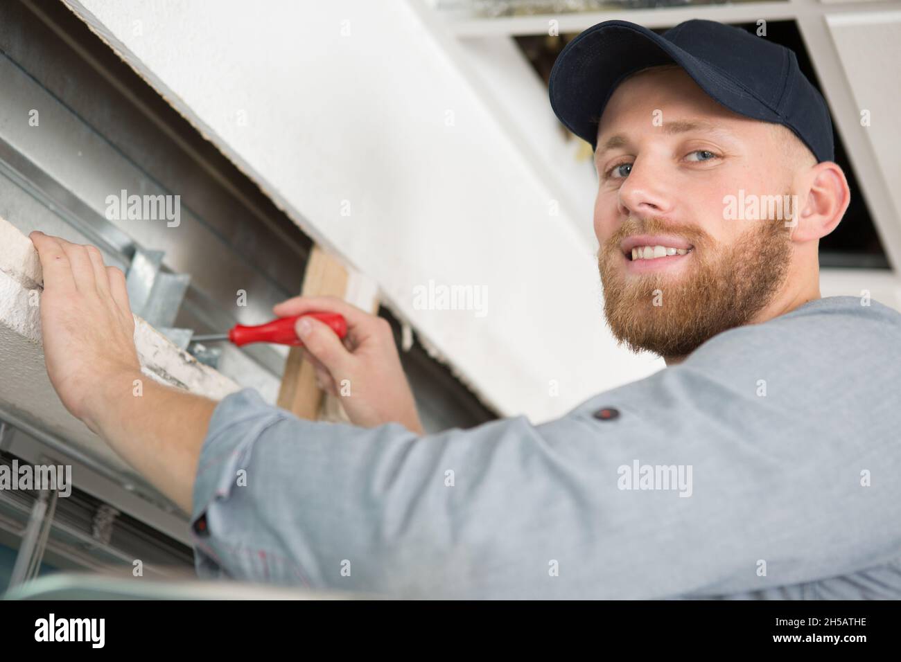 builder working on wall cavity Stock Photo - Alamy