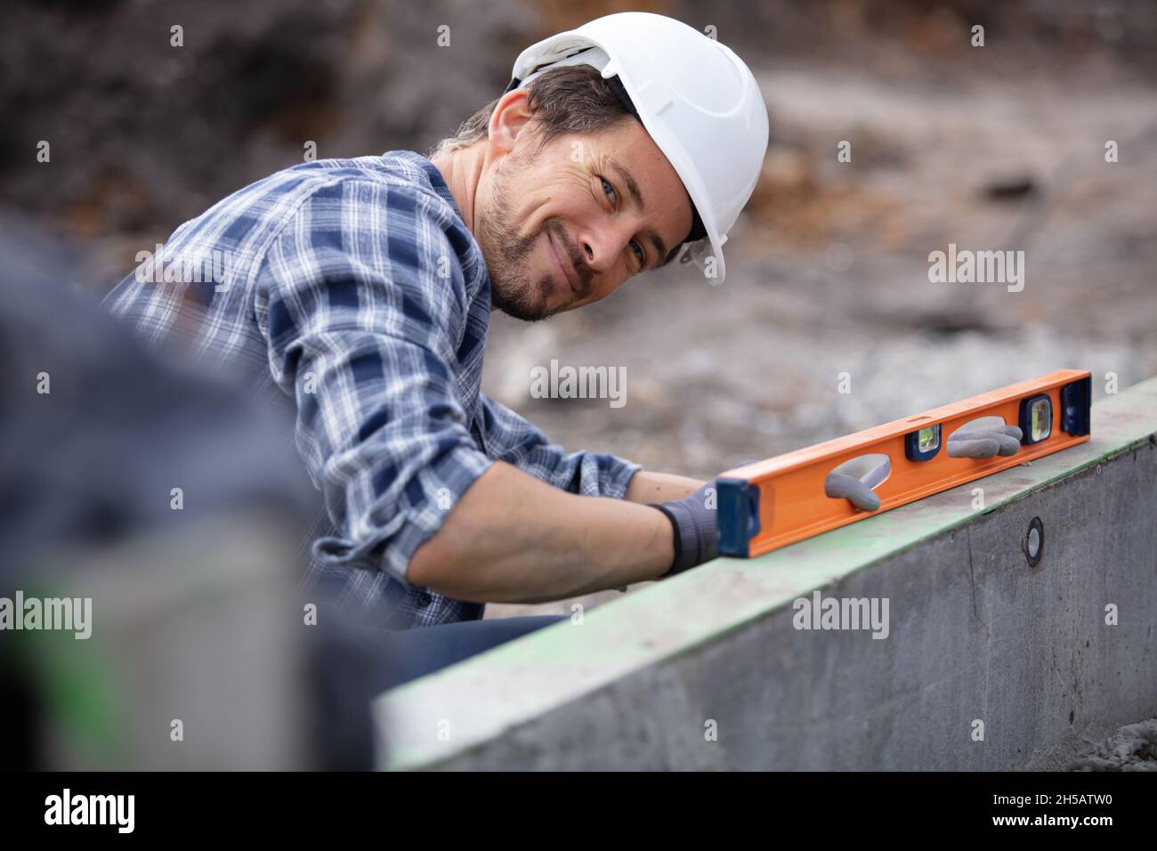 civil engineer measuring with a tubular spirit level Stock Photo - Alamy