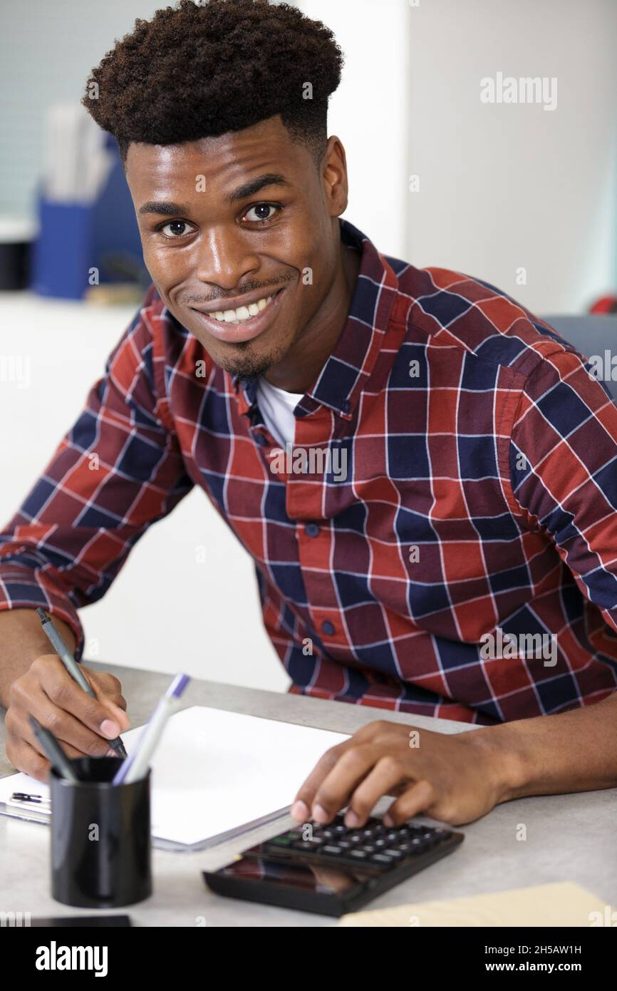 Man holding a calculator hi-res stock photography and images - Alamy
