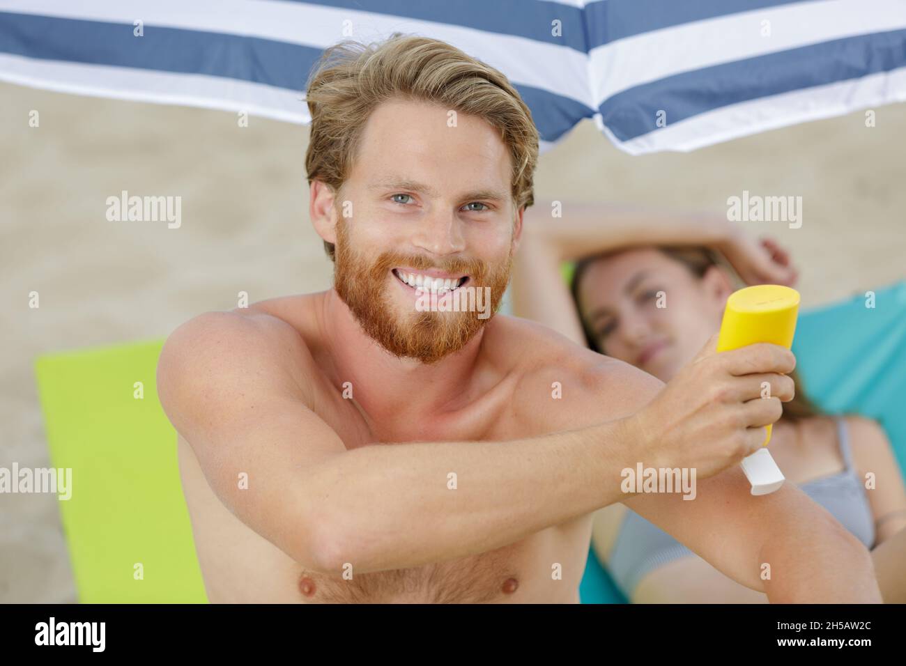 Using suncream hi-res stock photography and images - Alamy