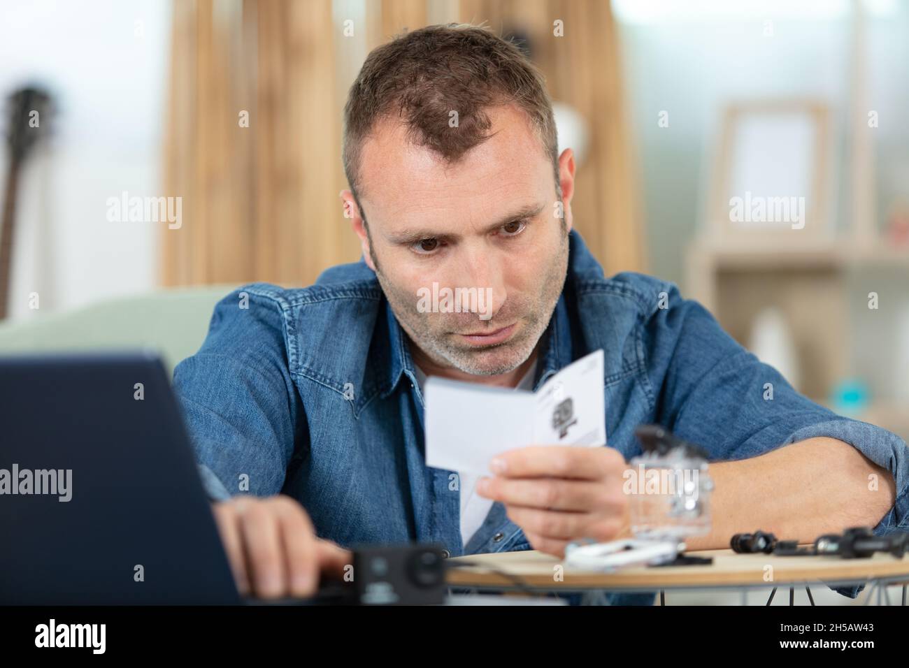 serious man sitting at his desk in the office Stock Photo - Alamy
