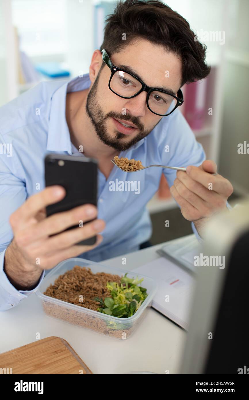 Crazy young man eating technology hi-res stock photography and images ...