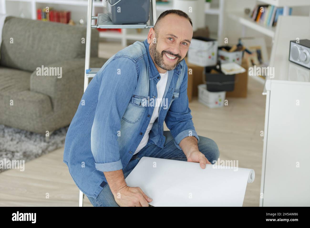 Man doing diy hi-res stock photography and images - Alamy