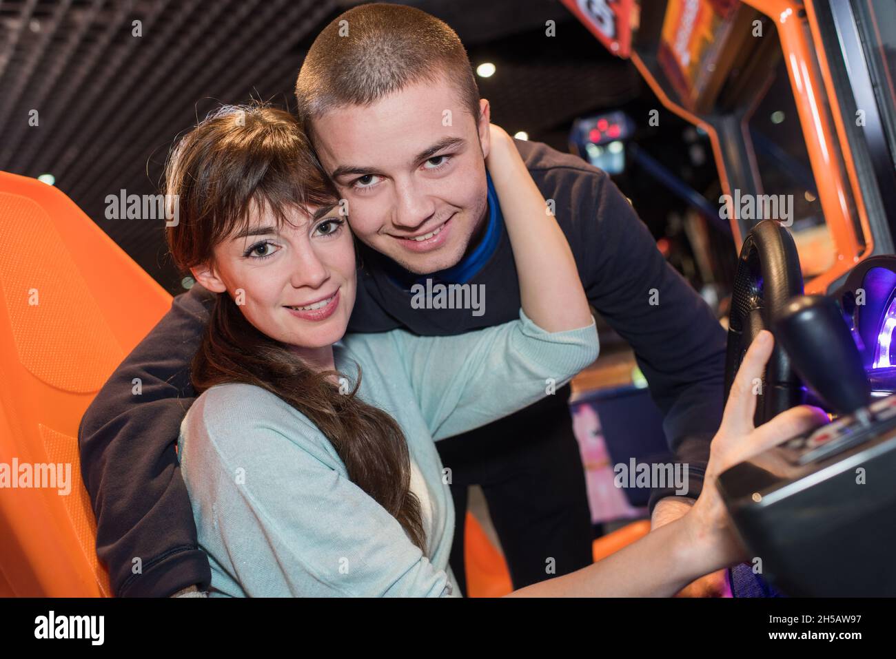 portrait of young couple in games arcade Stock Photo - Alamy
