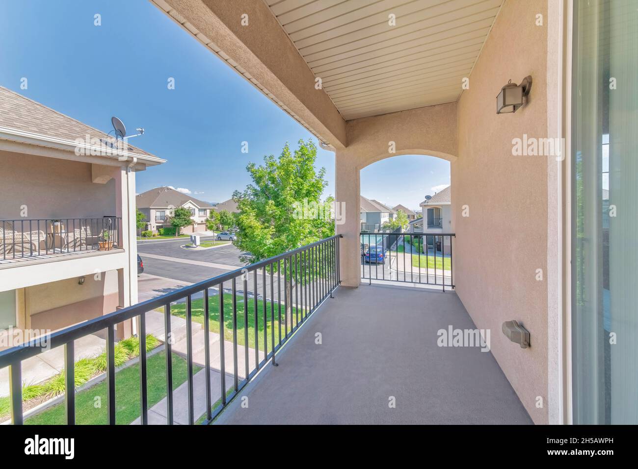 Terrace of a residential building with metal railing and concrete ...