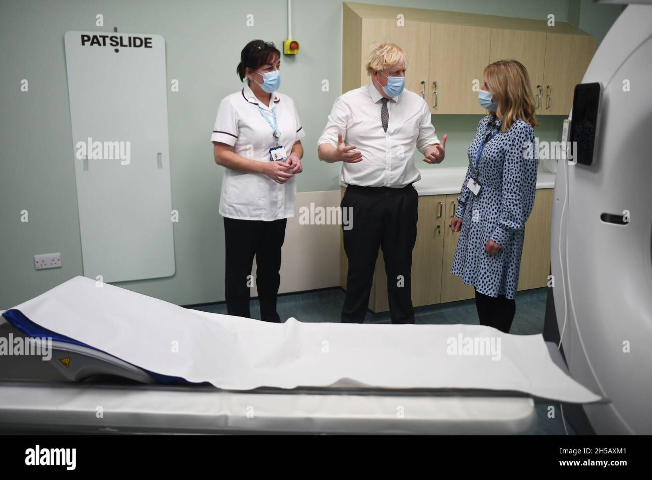 Prime Minister Boris Johnson is shown around a CT scan room during a ...
