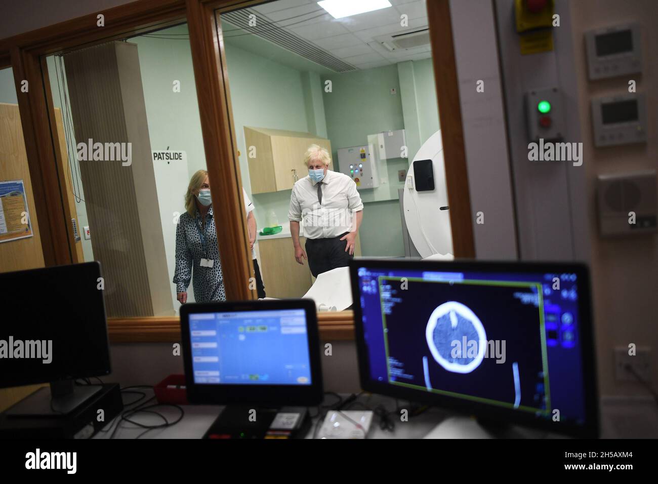 Prime Minister Boris Johnson is shown around a CT scan room during a ...