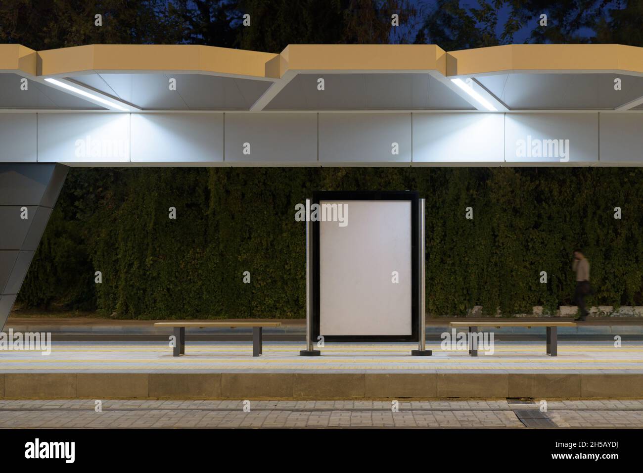 Poster stand at night. Street billboard mock up at a public transport ...