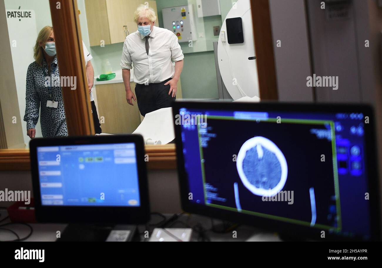 Prime Minister Boris Johnson is shown around a CT scan room during a ...