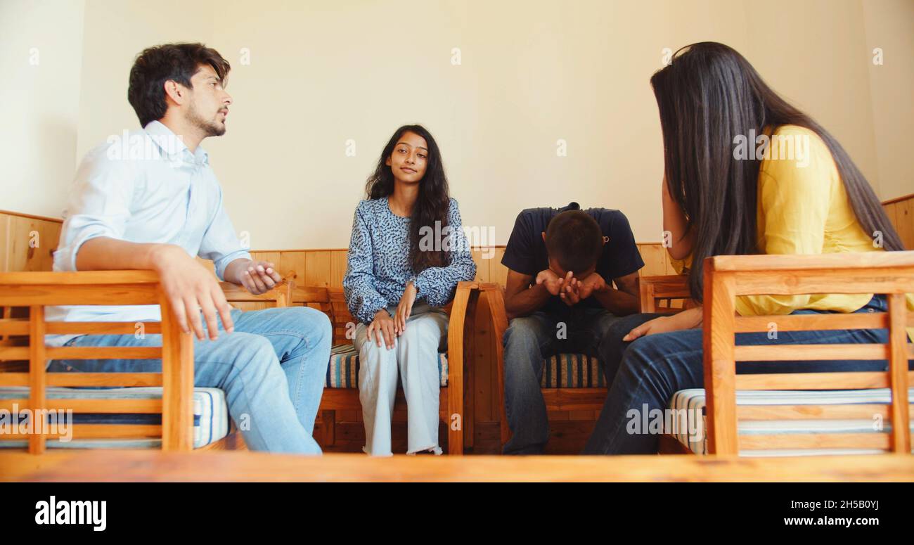 Indian couples sitting happily at home - double date Stock Photo - Alamy