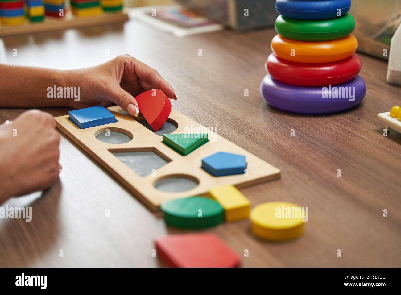 Patient woman practices ergotherapy in rehab center Stock Photo - Alamy