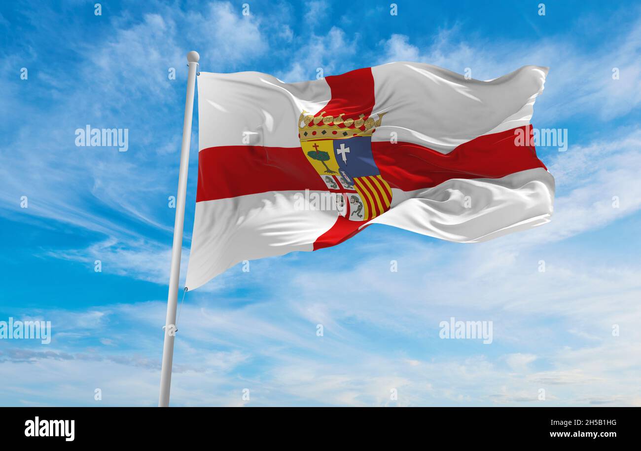 flag of Zaragoza province with coat of arms , Spain at cloudy sky ...