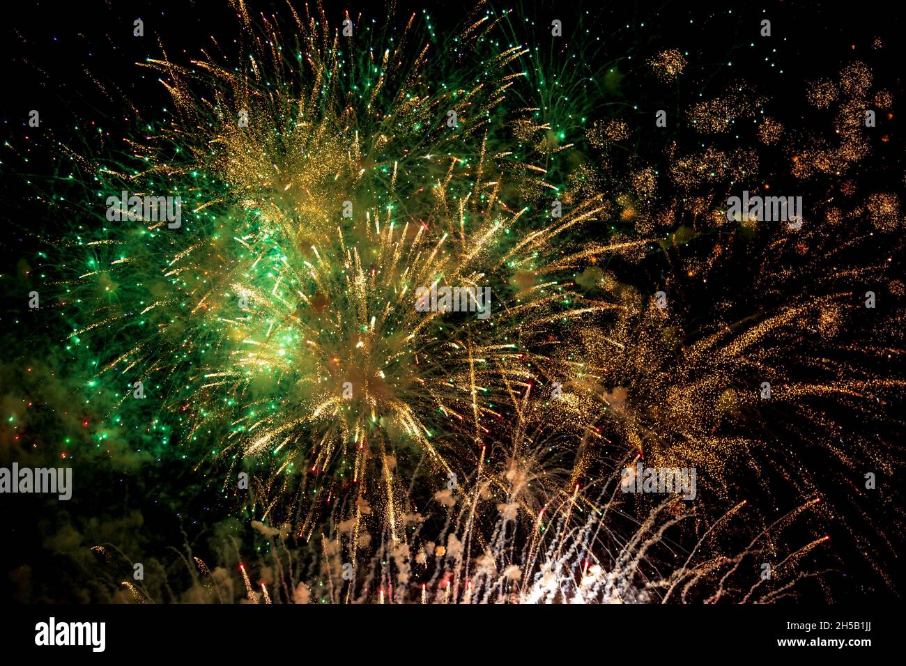 Colourful fireworks exploding against a night sky Stock Photo - Alamy