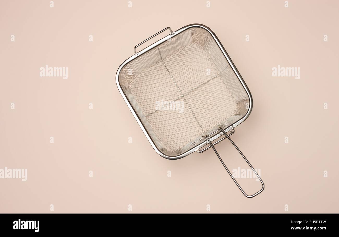 square basket sieve for frying in oil, top view Stock Photo - Alamy