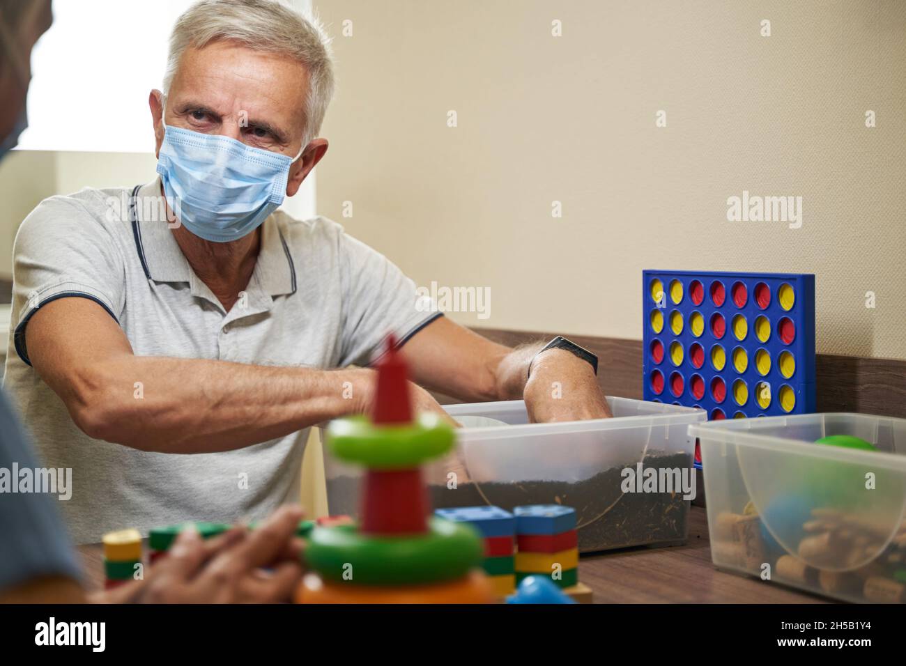 Photo of ergotherapy with stroke man in rehab center Stock Photo - Alamy