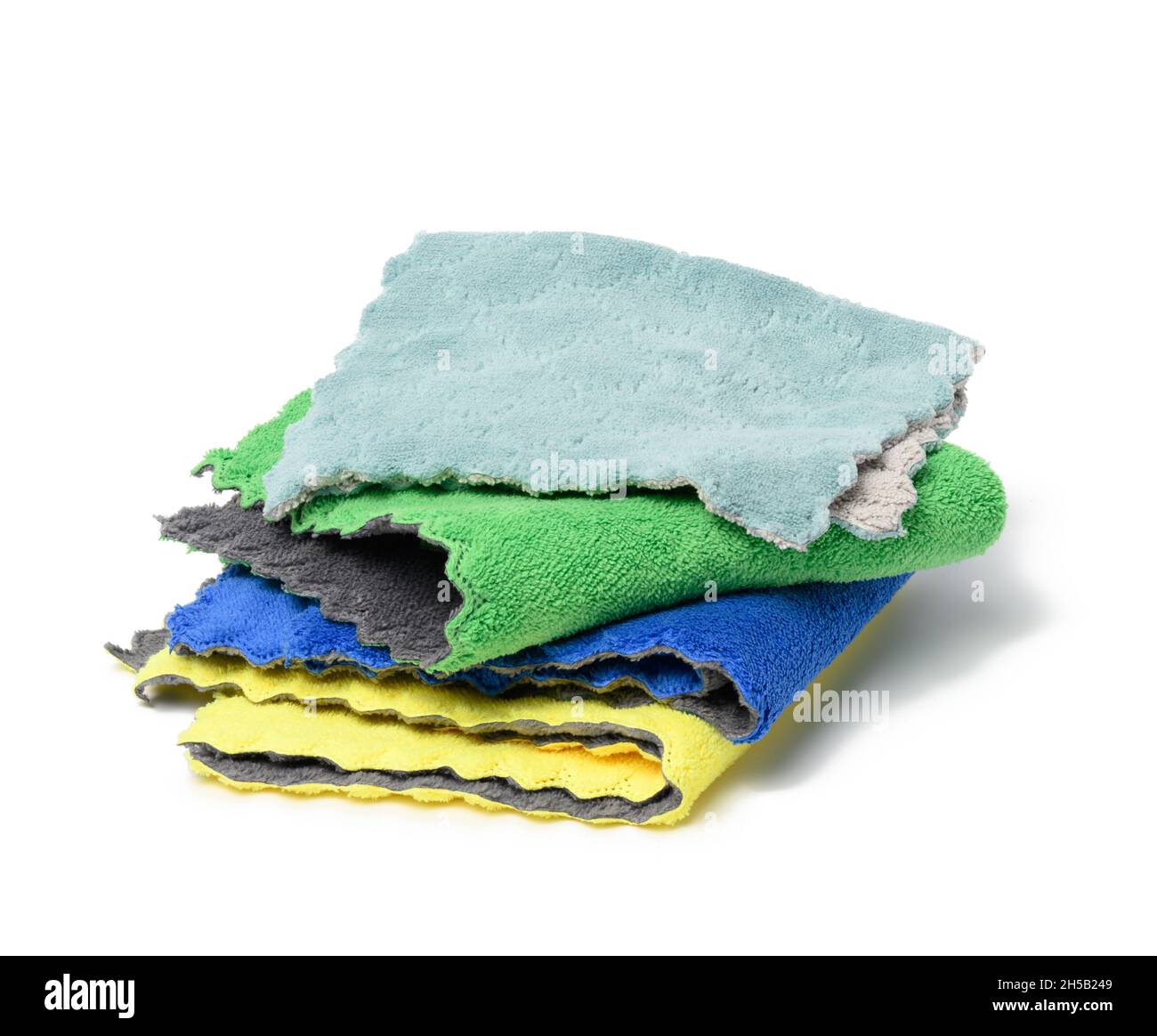 stack of textile multicolored rags for cleaning on a white background ...