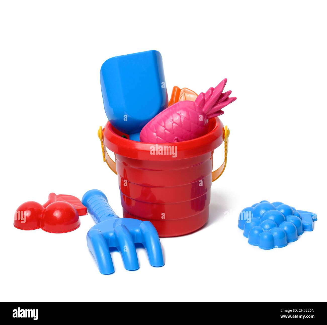 baby red plastic bucket with shovel and toys isolated on white ...