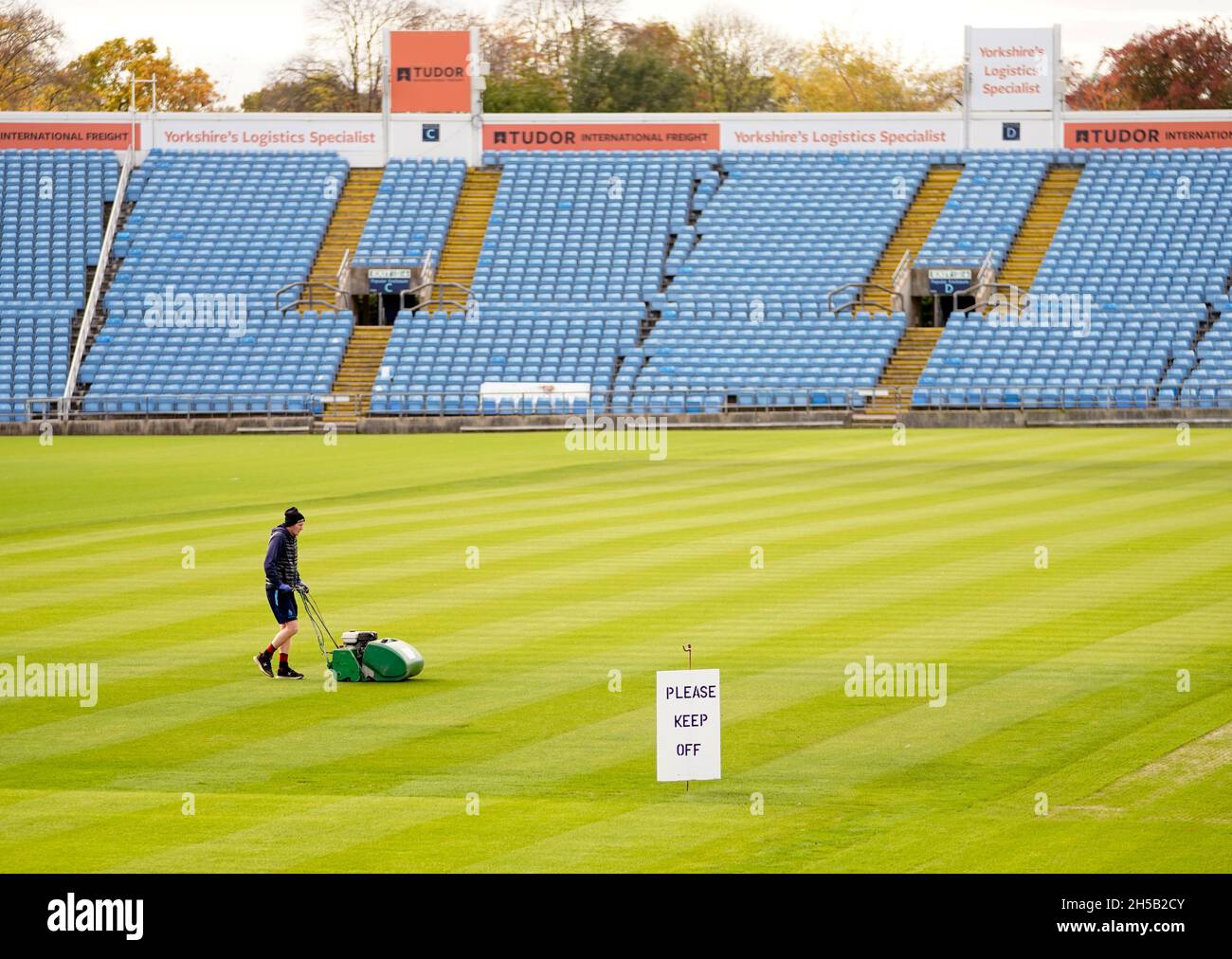 A groundsperson tends to the pitch at Headingley Cricket Ground, Leeds ...