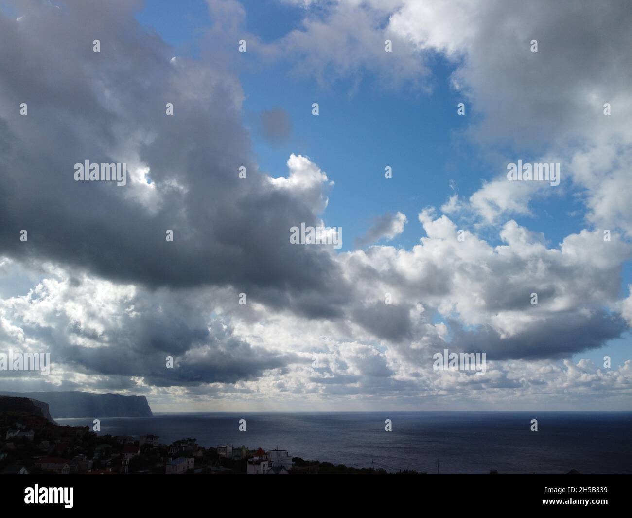 Abstract airy sky with moving plump clouds over the sea ocean. Small ...