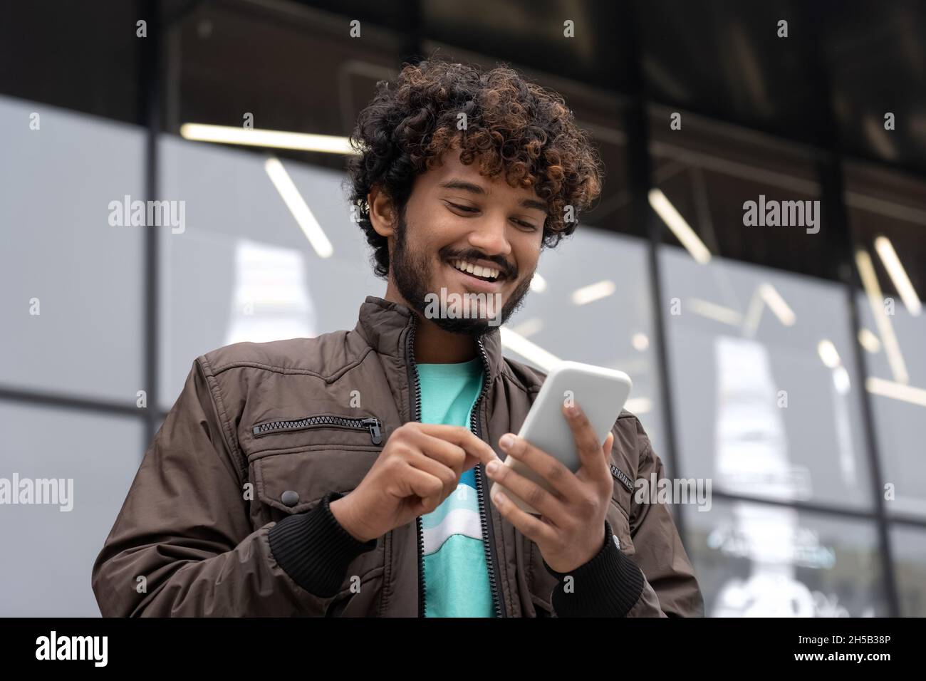 Young indian man smiling hi-res stock photography and images - Alamy