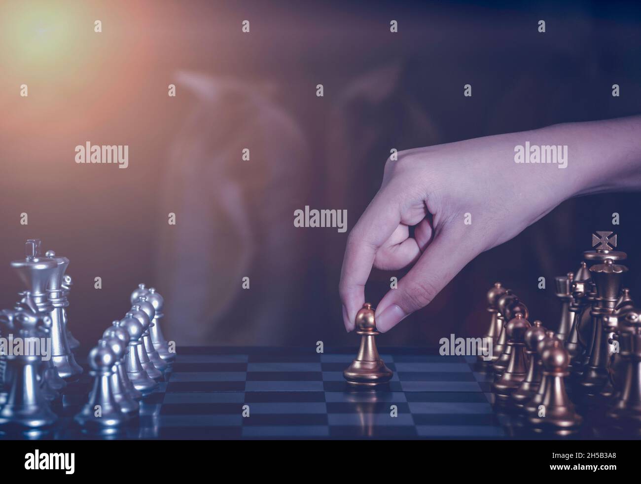 Hand of confident boy moving pawn chess to development in competition ...