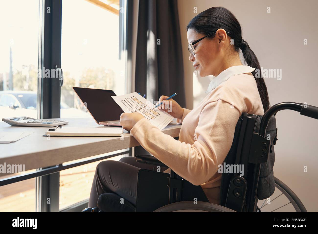 Serious female disability doing hi-res stock photography and images - Alamy