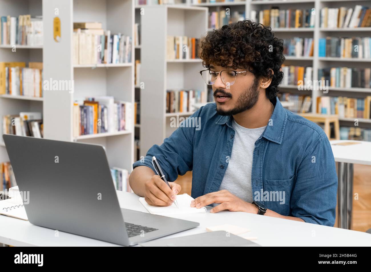 Indian student with laptop hi-res stock photography and images - Alamy