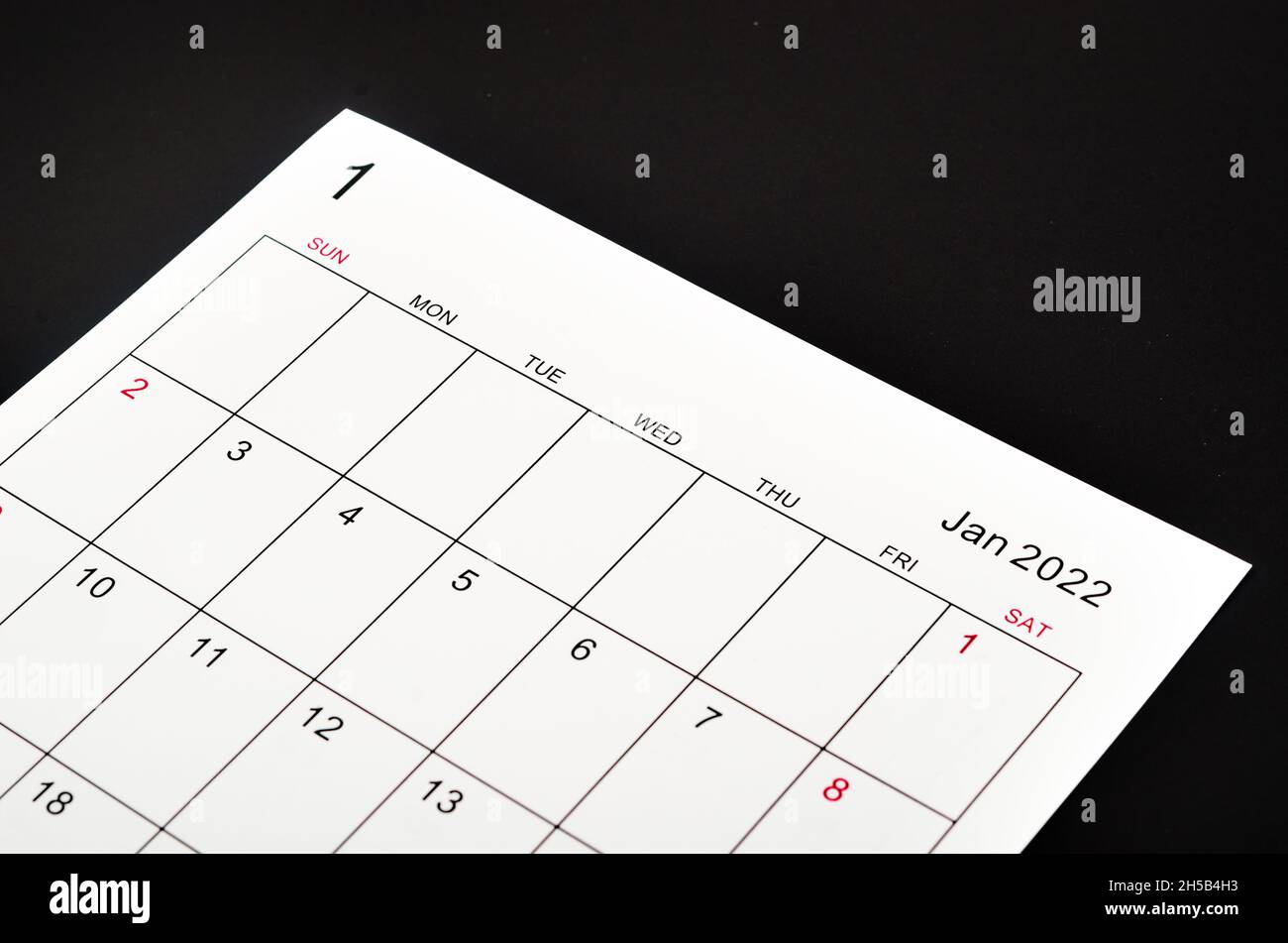 Close up January 2022 calendar sheet on black background Stock Photo ...
