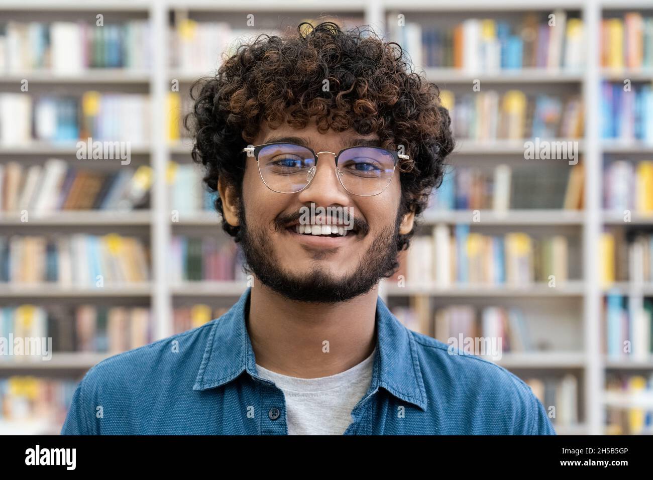 Indian man reading book on hi-res stock photography and images - Alamy