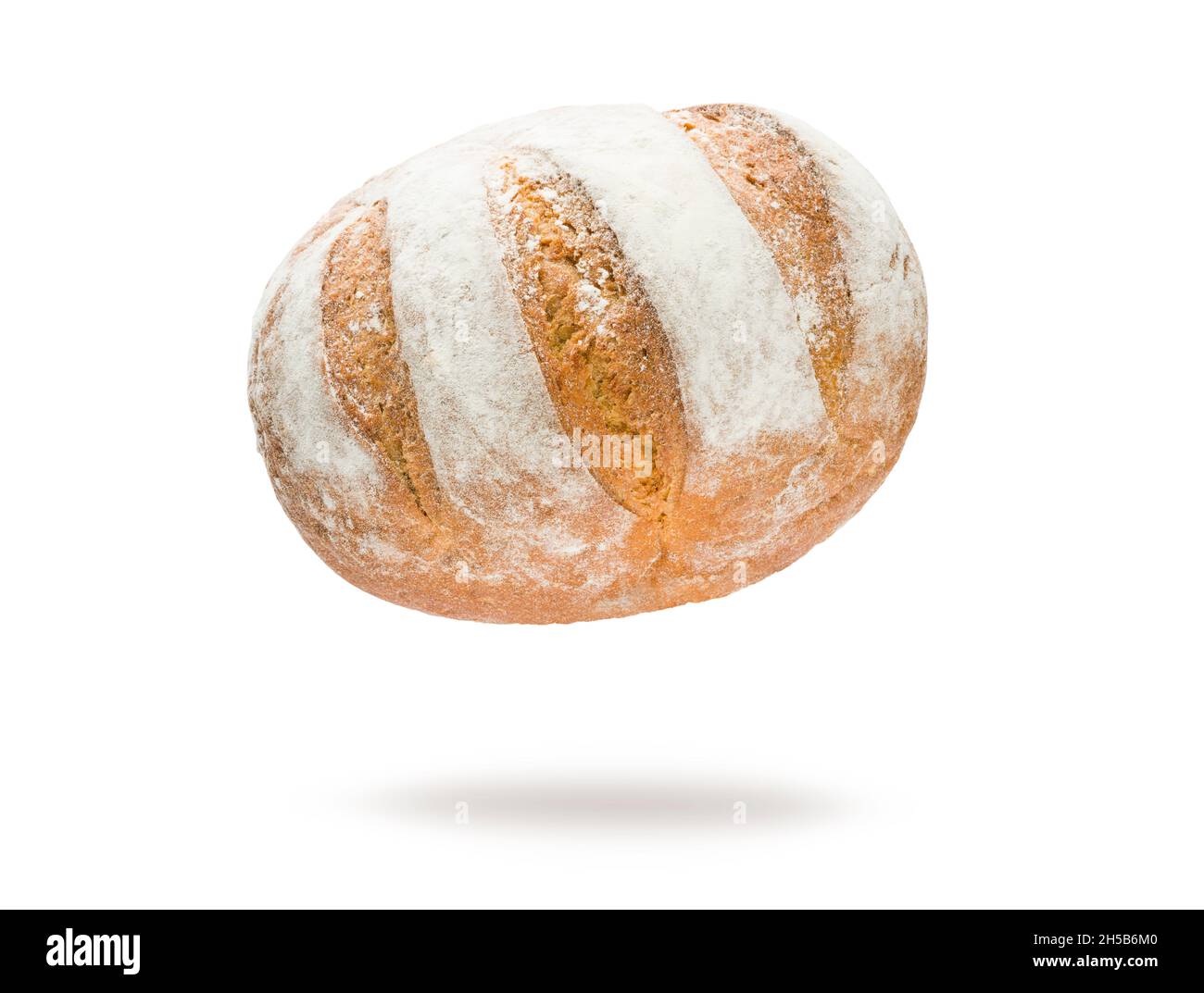 Fresh loaf of bread floating on white background Stock Photo - Alamy
