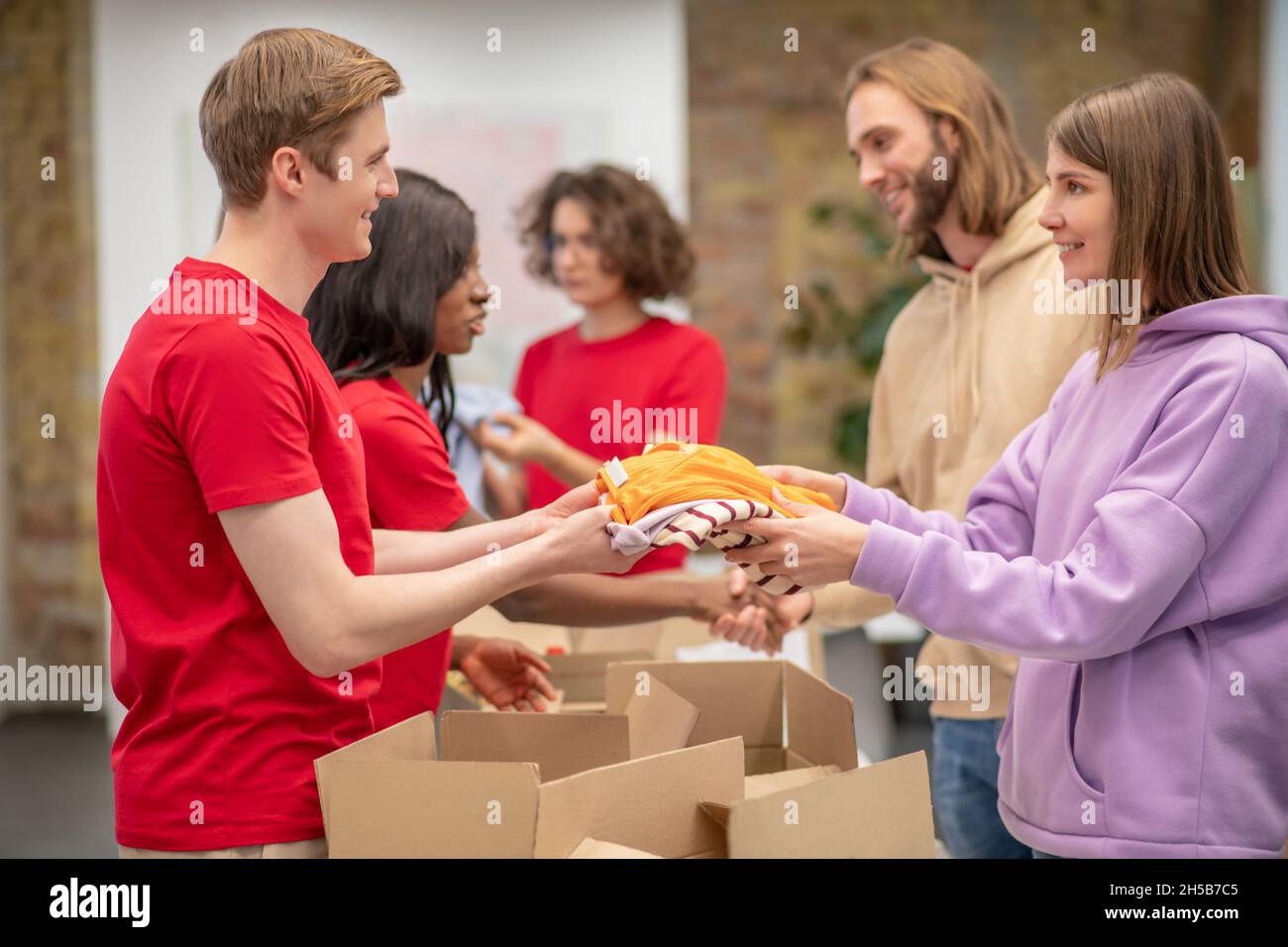 Workers of the non profit organization distributing donations Stock ...