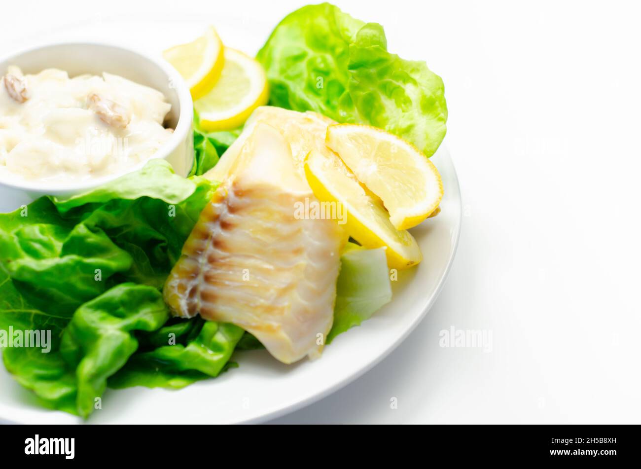 Steamed haddock fillet served with an exquisite salad consisting of ...