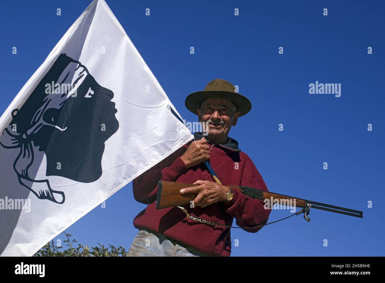 HUNTER WITH CORSICAN FLAG, FRANCE Stock Photo - Alamy