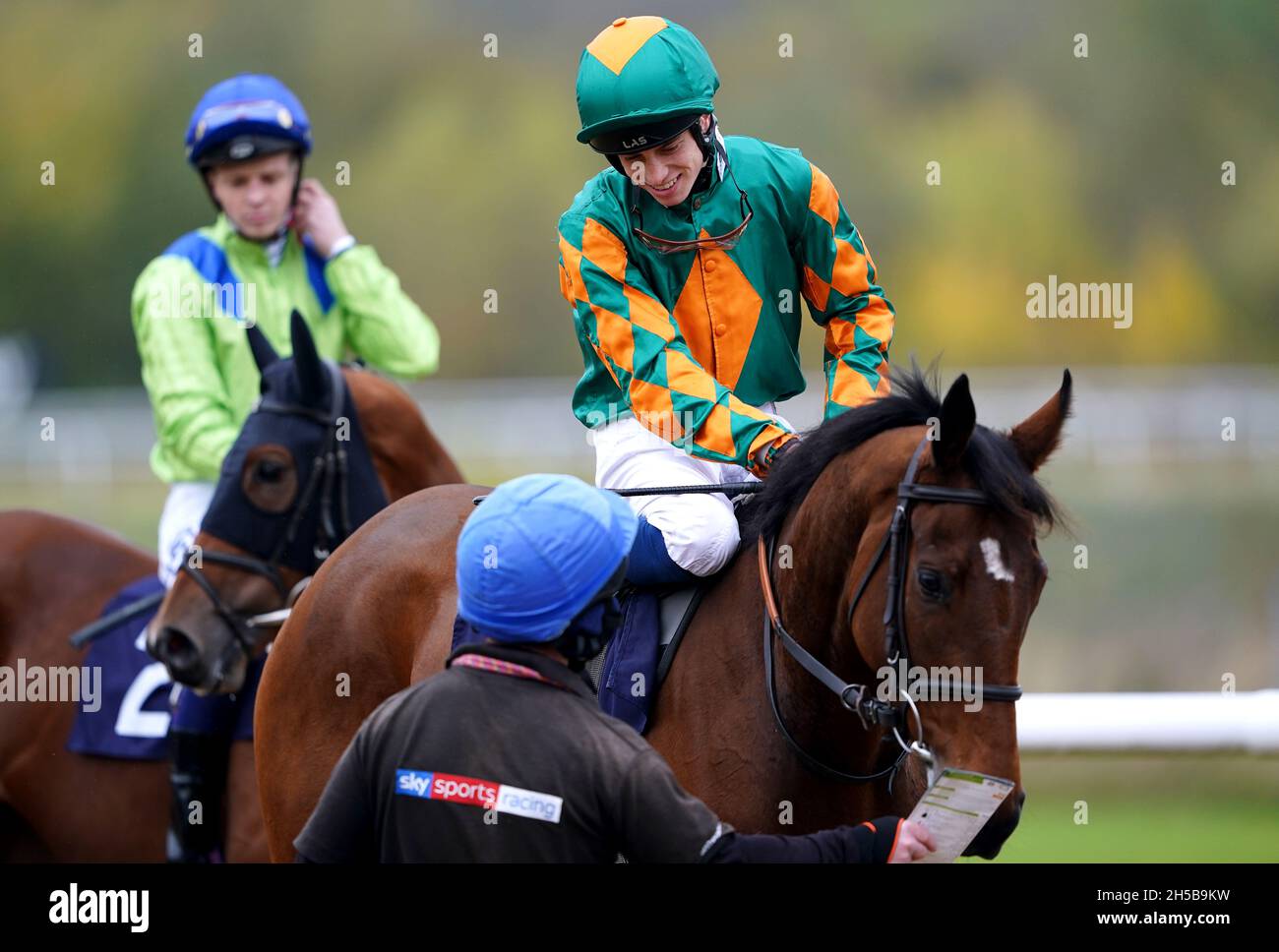 Jockey George Rooke looks at the race card prior to competing in the ...