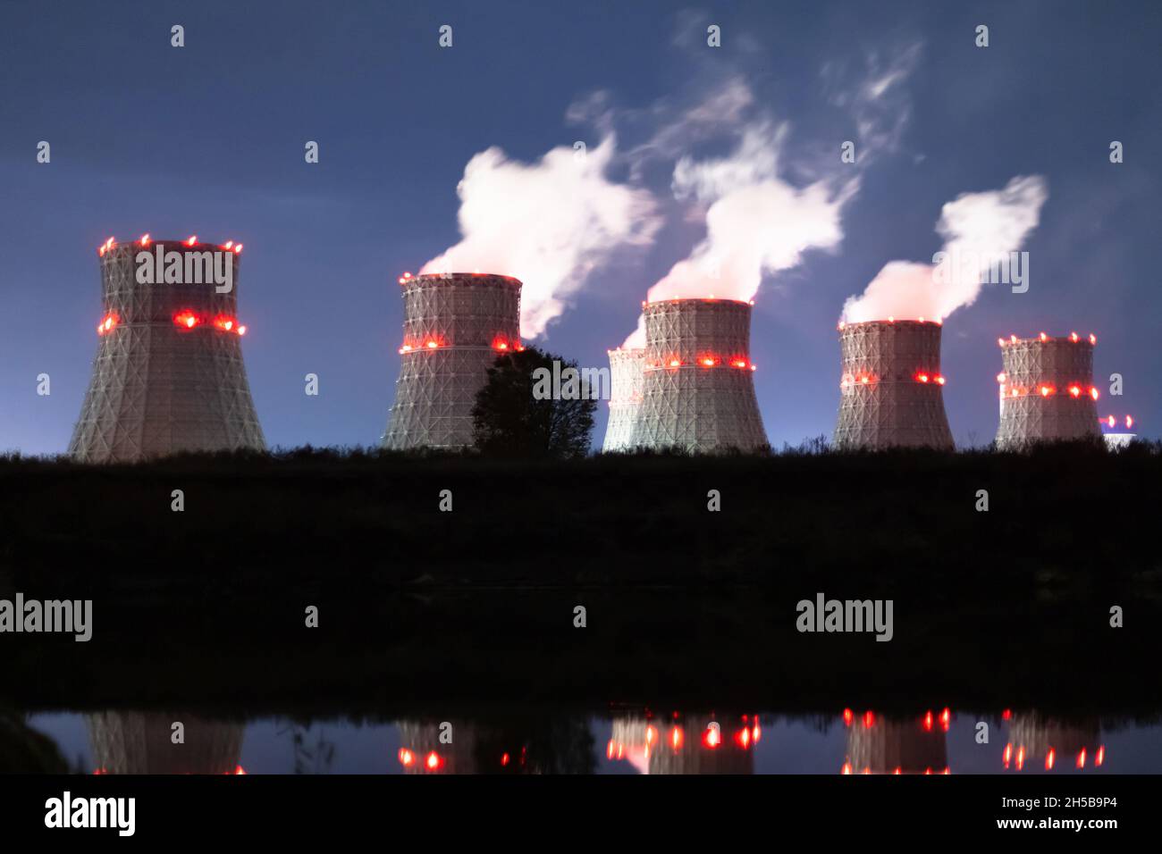 nuclear power plant at night. Air emissions Stock Photo - Alamy