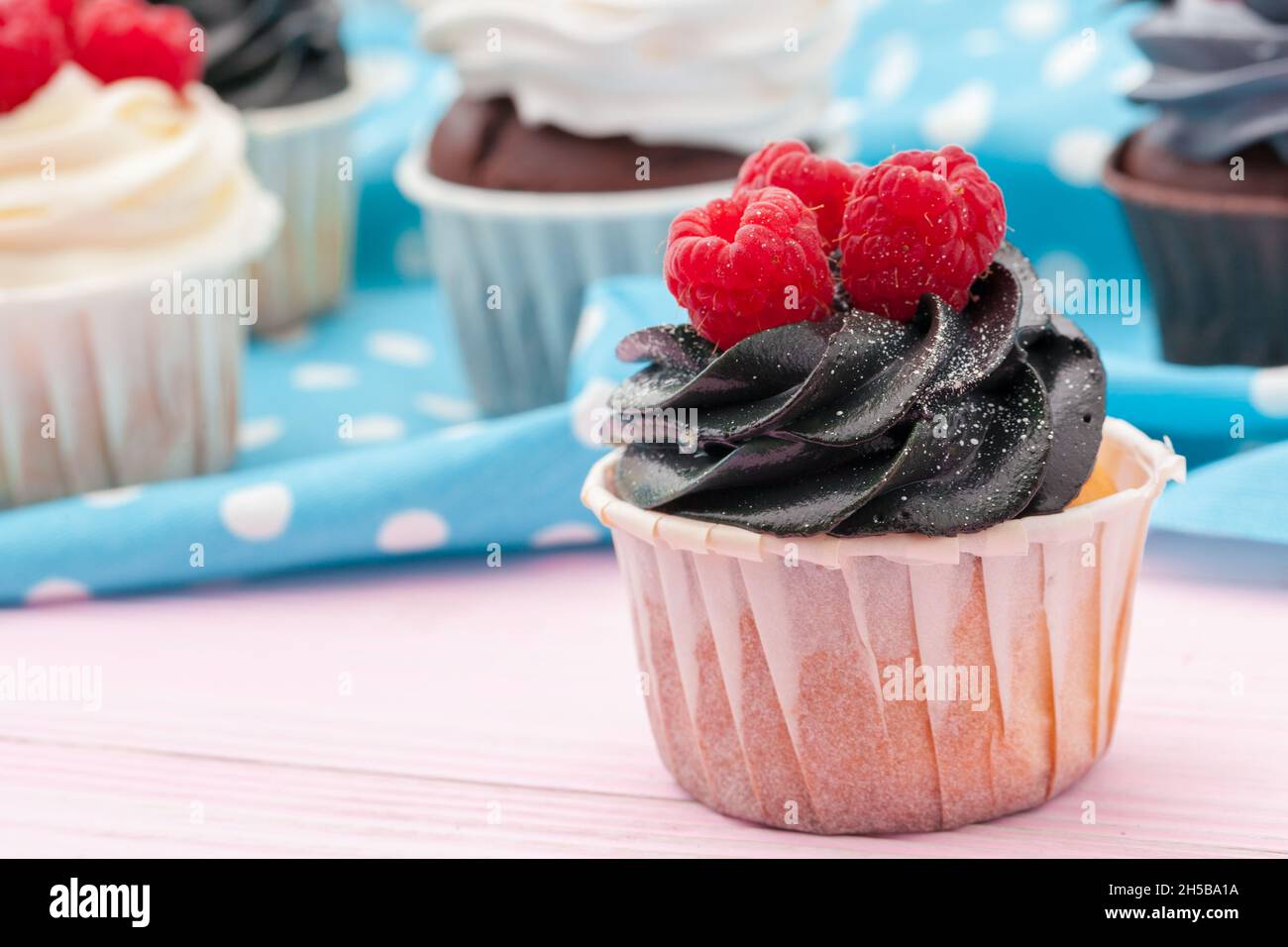 Cupcakes decorated with sprinkles and frosting - close up Stock Photo - Alamy