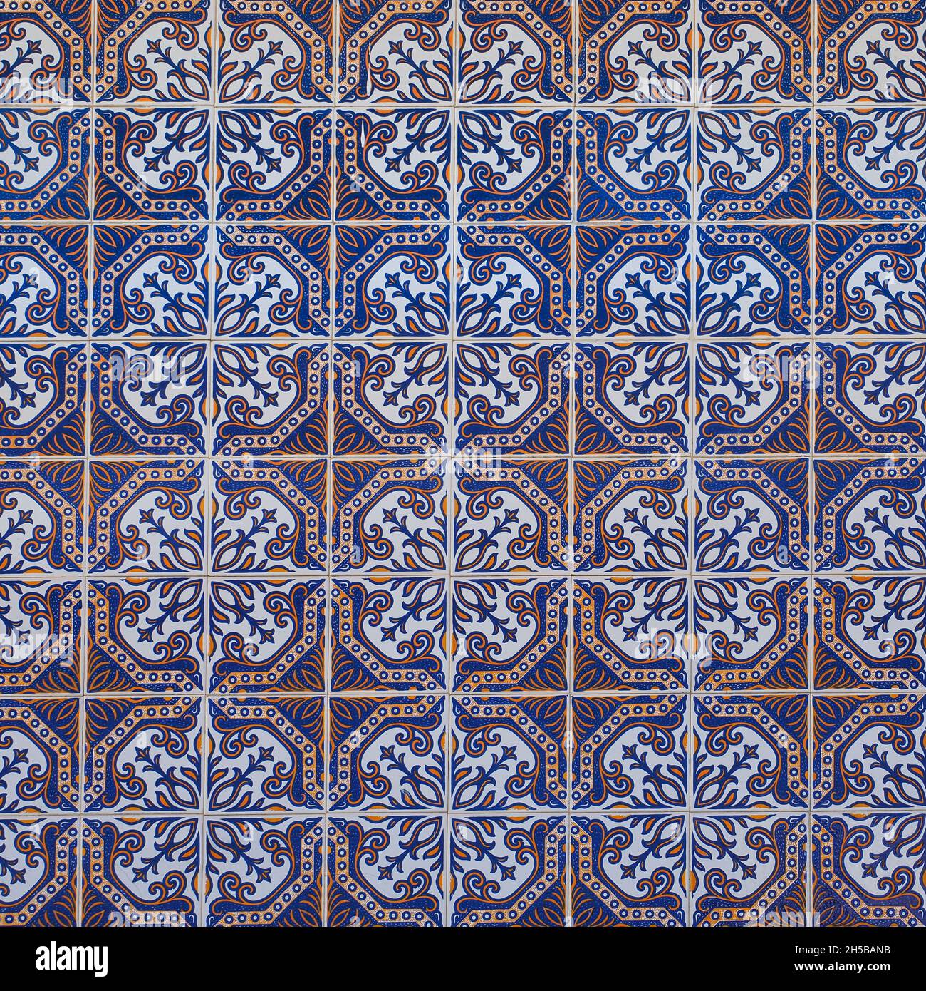 Fragment of building wall with colorful ceramic wall tiles. Azulejos ...