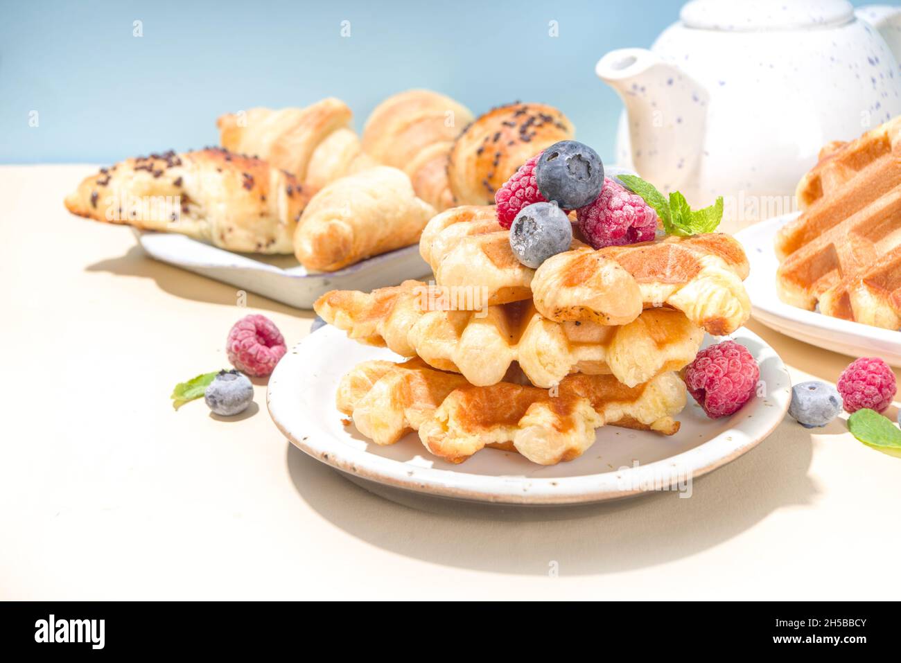 Modern dessert croffle - mixture of croissants and waffles, puff baking ...