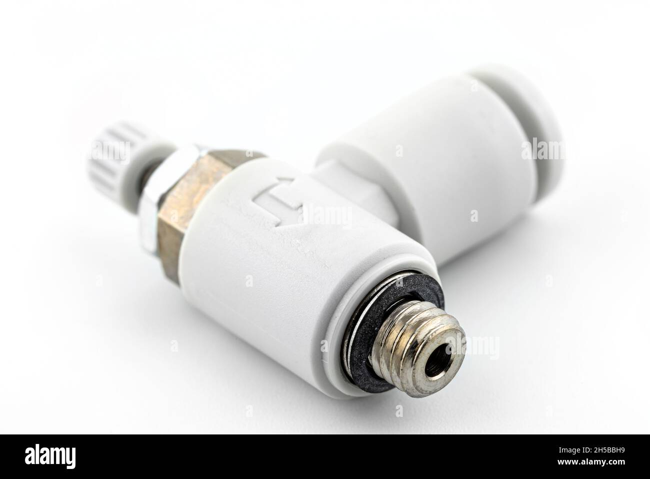 Macro image of a white adjustable air pneumatic elbow fitting with ...