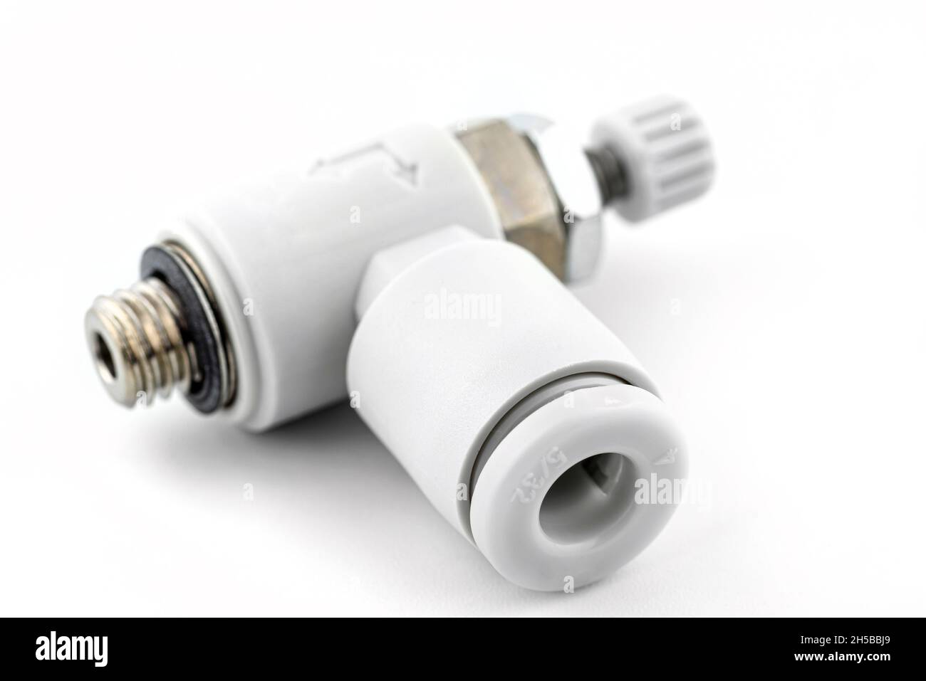 Macro image of a white adjustable air pneumatic elbow fitting with ...