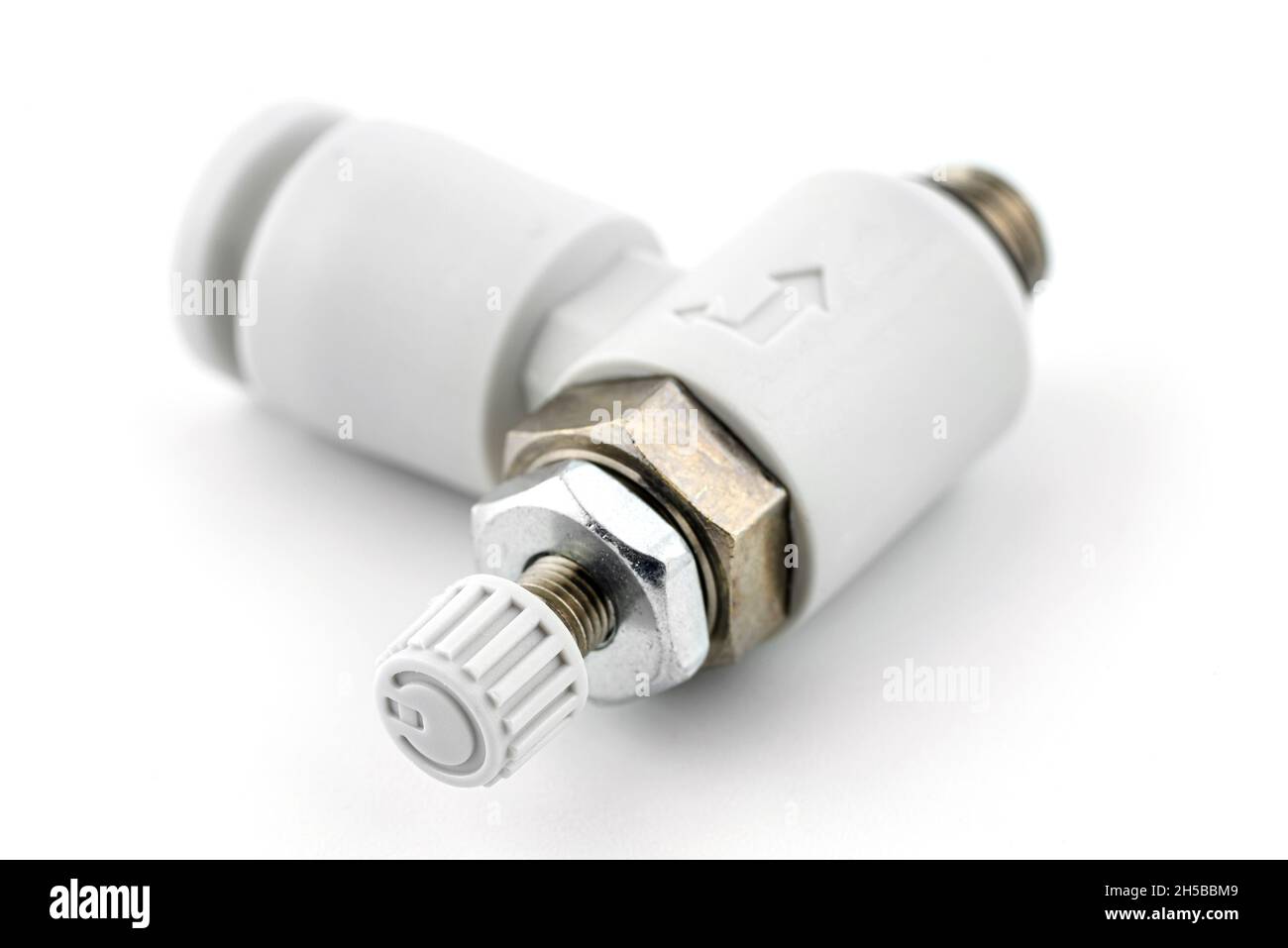 Macro image of a white adjustable air pneumatic elbow fitting with ...