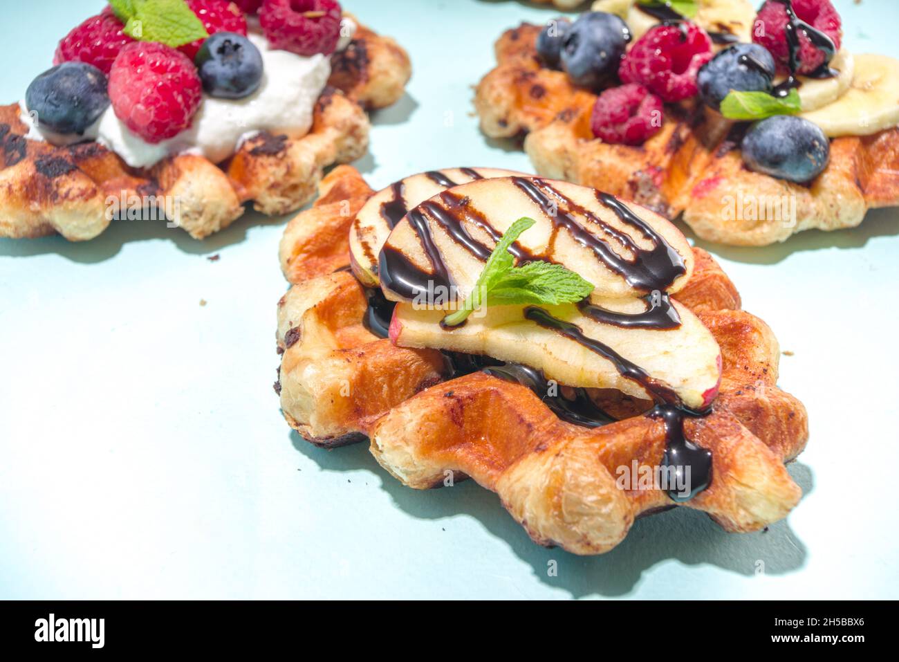 Modern dessert croffle - mixture of croissants and waffles, puff baking ...